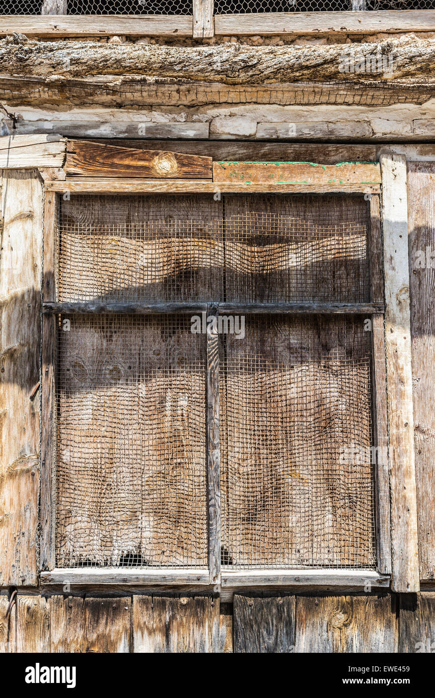 Old wooden window covered with a metal grate in Spain Stock Photo - Alamy