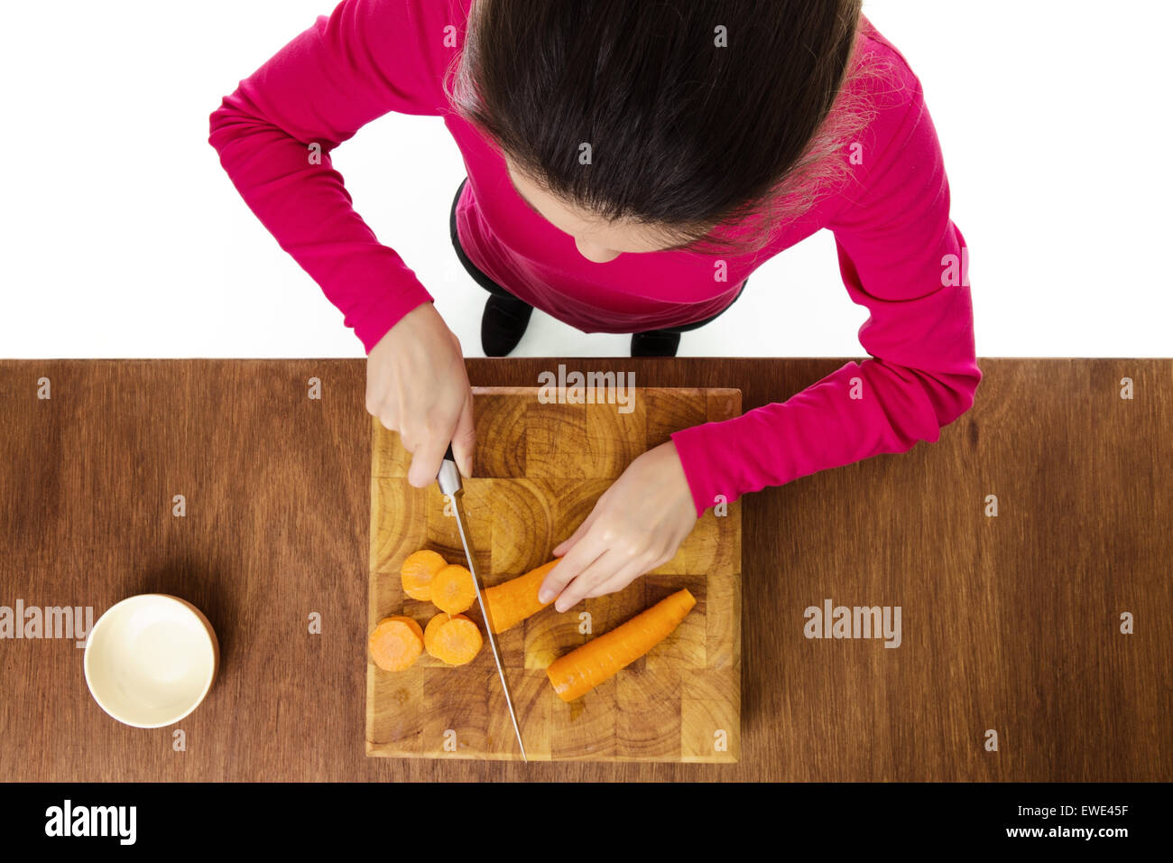 Woman chopping carrots kitchen close hi-res stock photography and ...