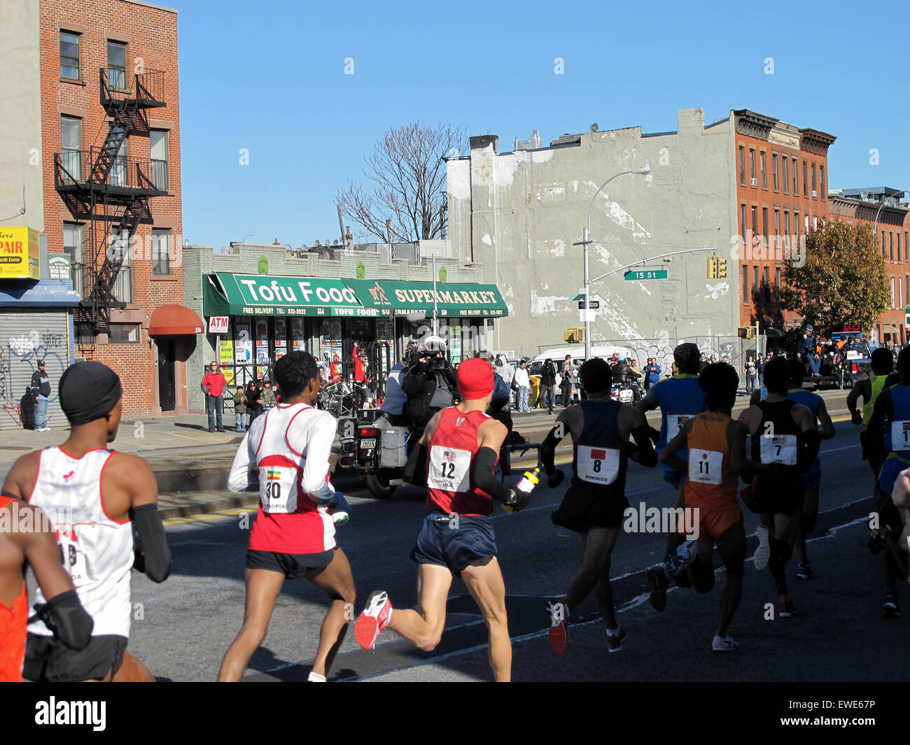 New York City marathon runners going through Brooklyn, NY Stock Photo ...