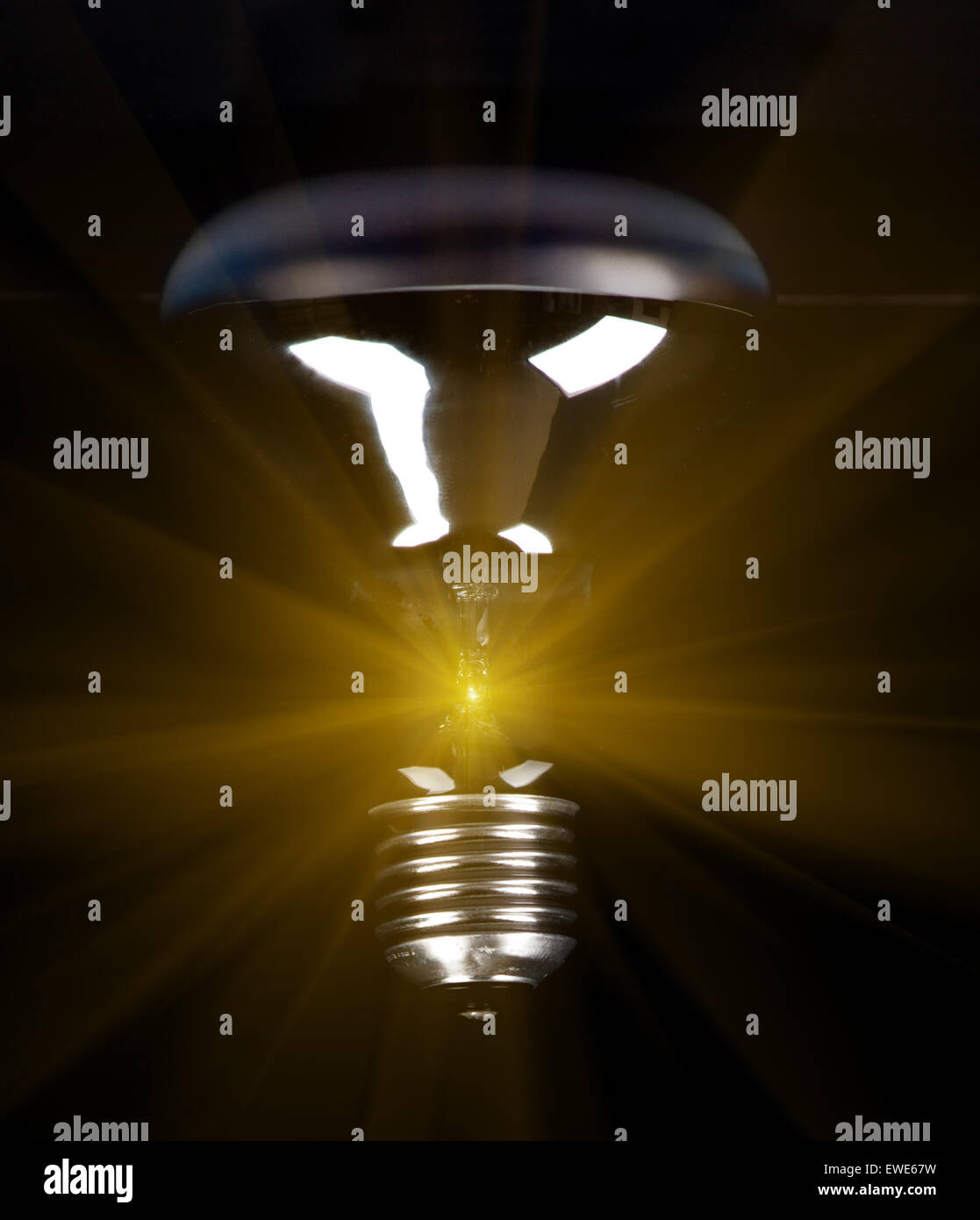 Matte light bulb on dark background with flare Stock Photo - Alamy