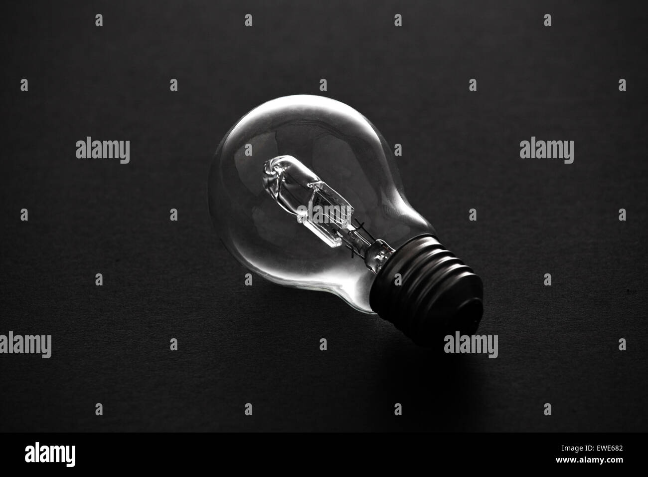 Halogen light bulb on dark background Stock Photo - Alamy