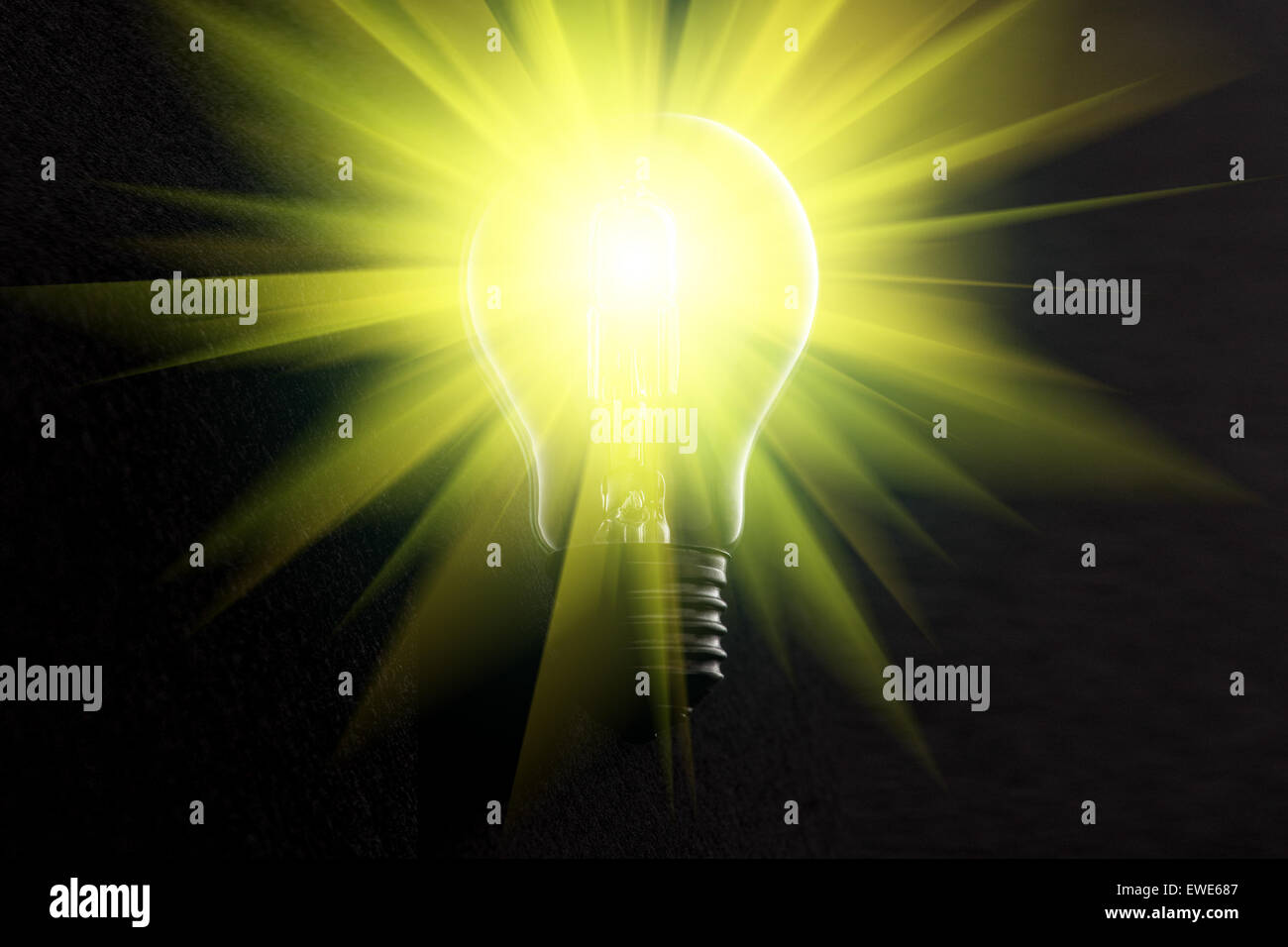 Halogen light bulb on dark background with light rays Stock Photo - Alamy