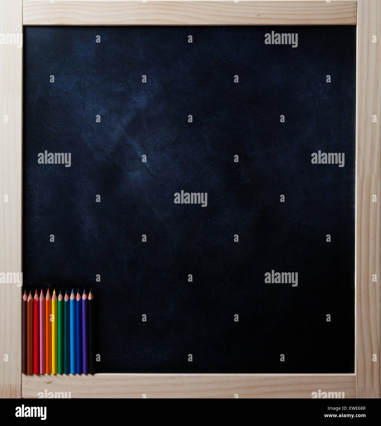 Square blackboard with colored pencils Stock Photo - Alamy
