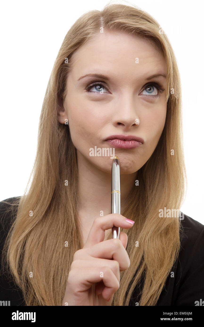happy woman holding a pen deep in thought Stock Photo - Alamy