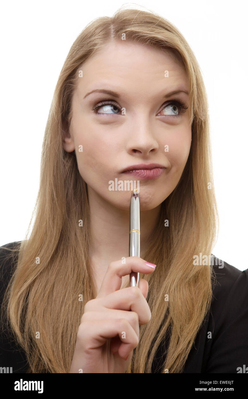 happy woman holding a pen deep in thought Stock Photo - Alamy