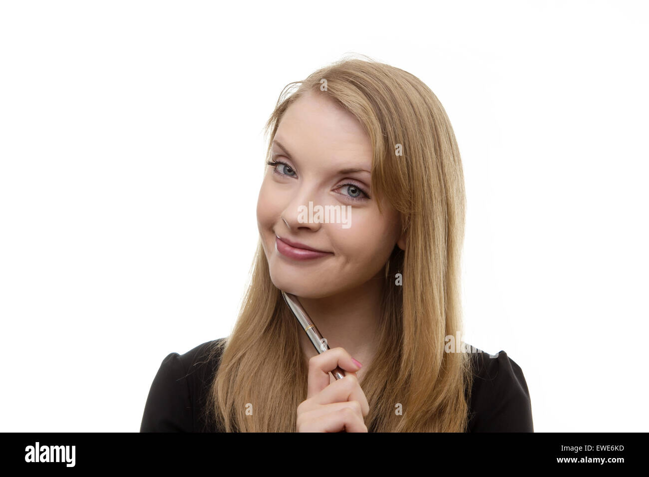 happy woman holding a pen deep in thought Stock Photo - Alamy