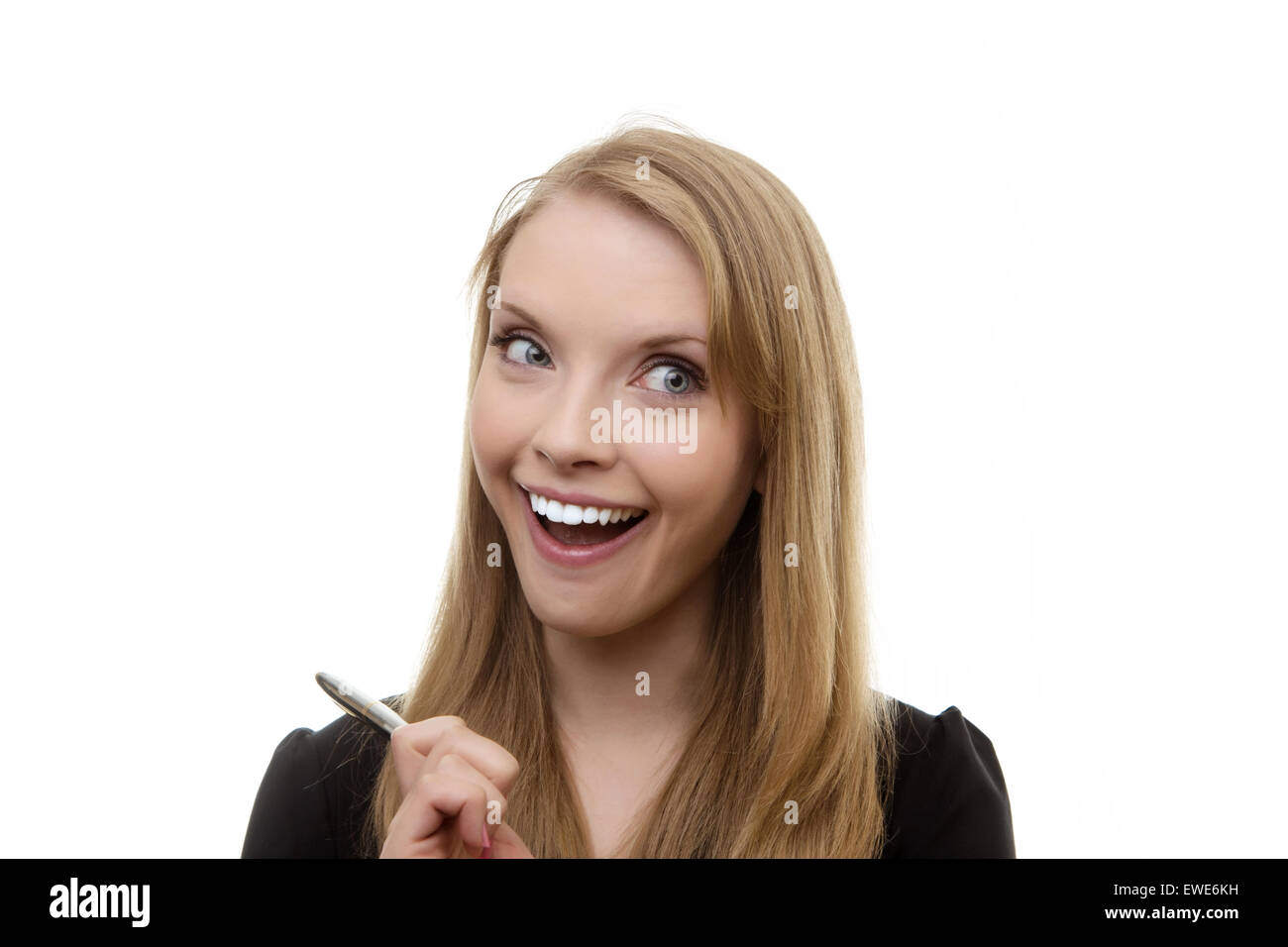 happy woman holding a pen deep in thought Stock Photo - Alamy