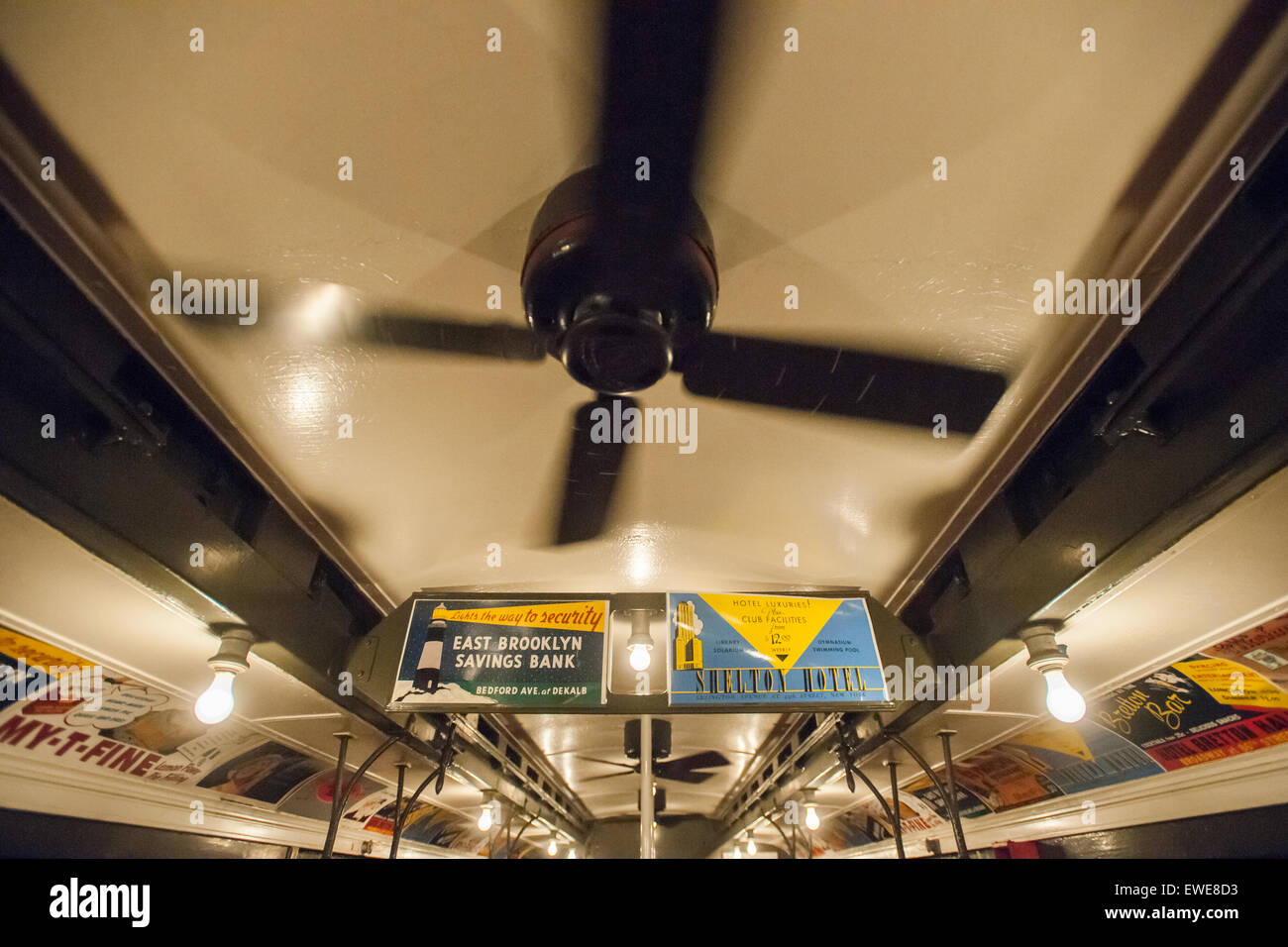 Detail of facsimile advertising and fans on a BMT D-Type Triplex train ...