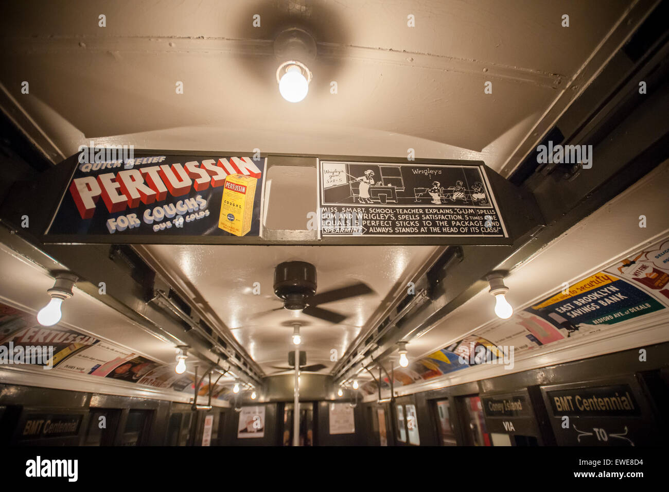 Detail of facsimile advertising and fans on a BMT D-Type Triplex train ...