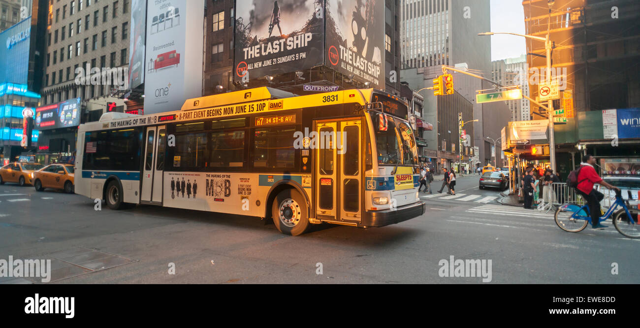 A NYCTA bus travels travels through Times Square in New York on Tuesday ...