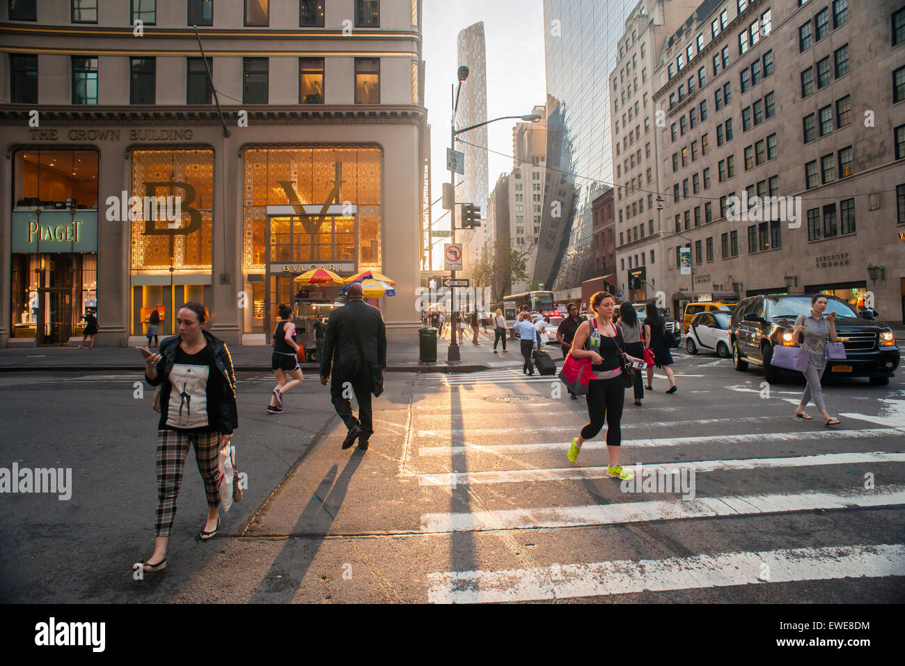 Pedestrians cross Fifth Avenue in New York on Tuesday, June 16, 2015 ...