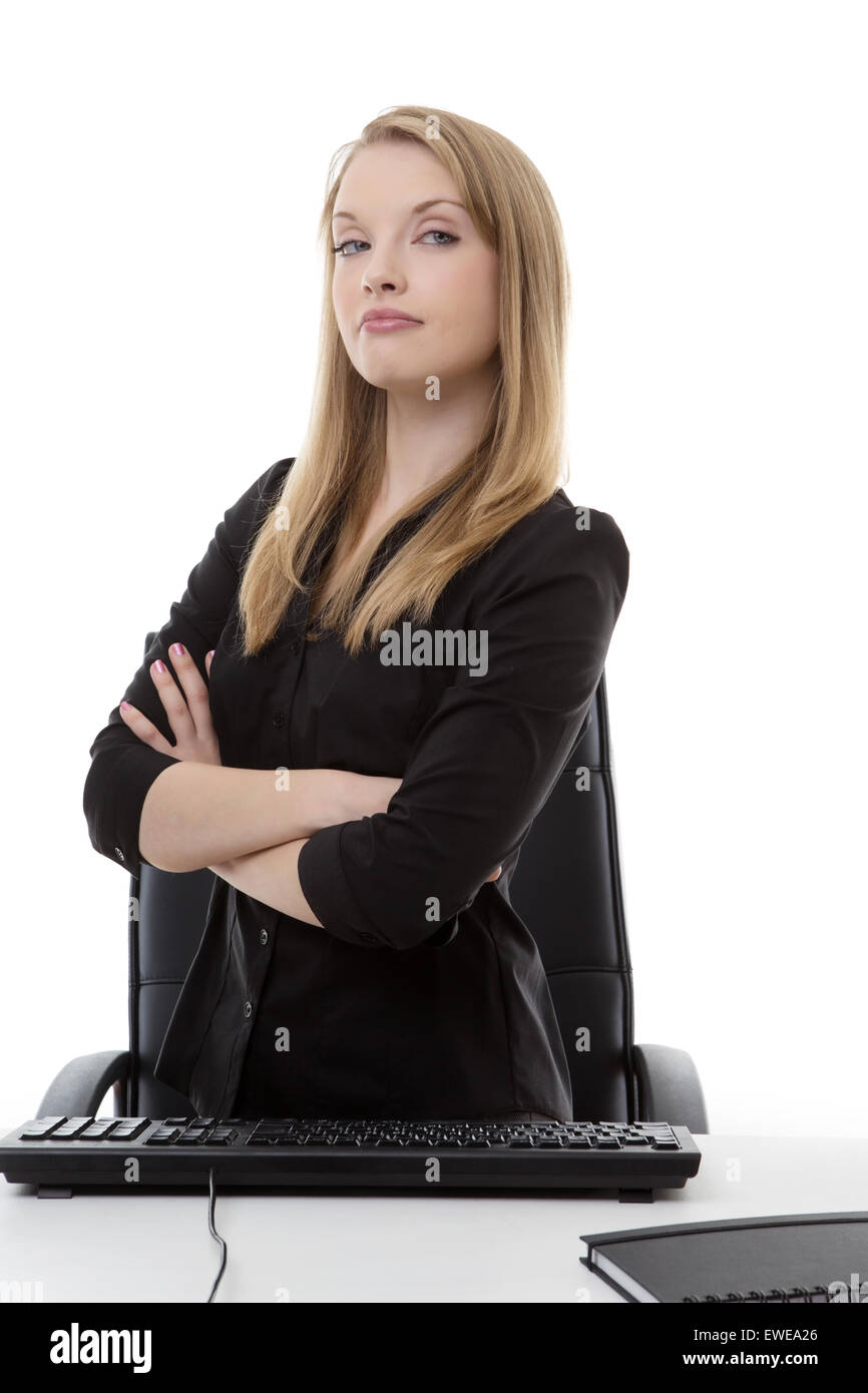 woman standing behind her desk looking important Stock Photo - Alamy