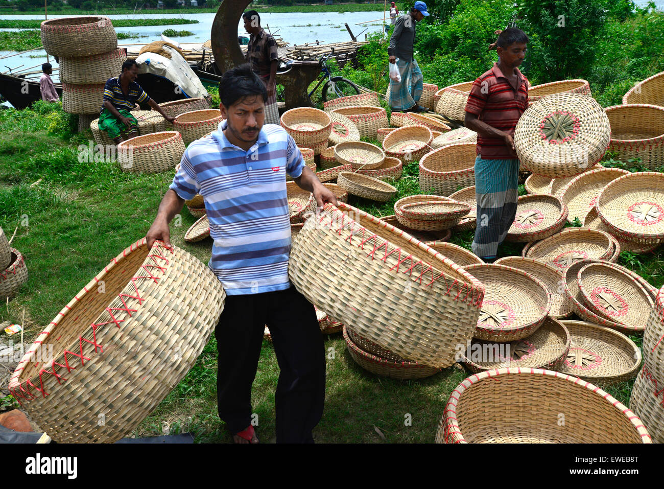 A trader displays fish basket for sale at Kaikkarateke weekly market ...