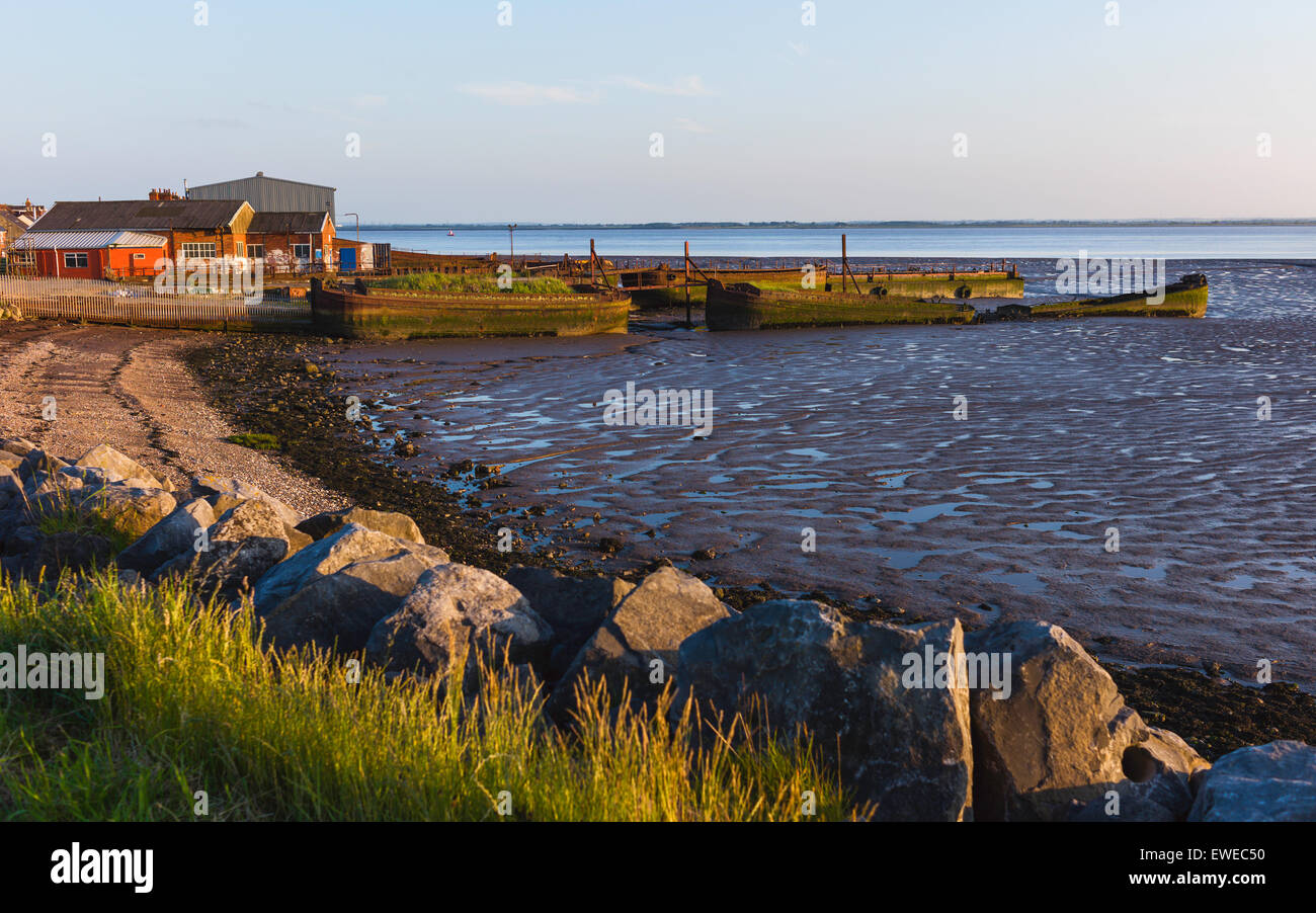 The Humber estuary at low tide with a view of a disused ship yard and ...