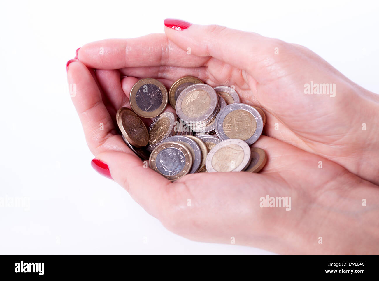 Woman hand showing an euro coin isolated on a white background Stock ...