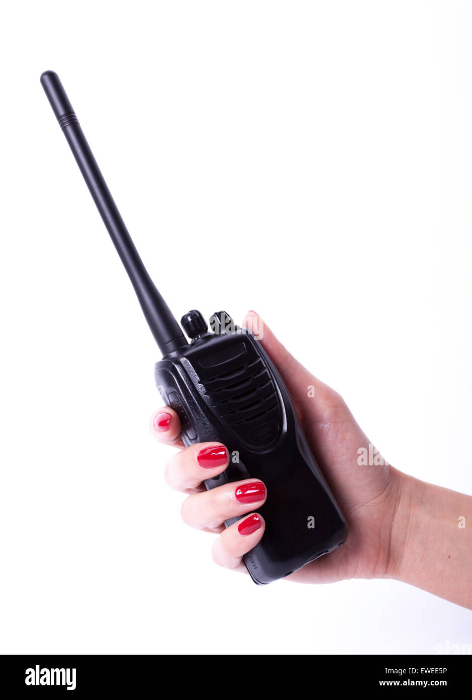 Female hand holding portable radio transmitter, isolated over white ...