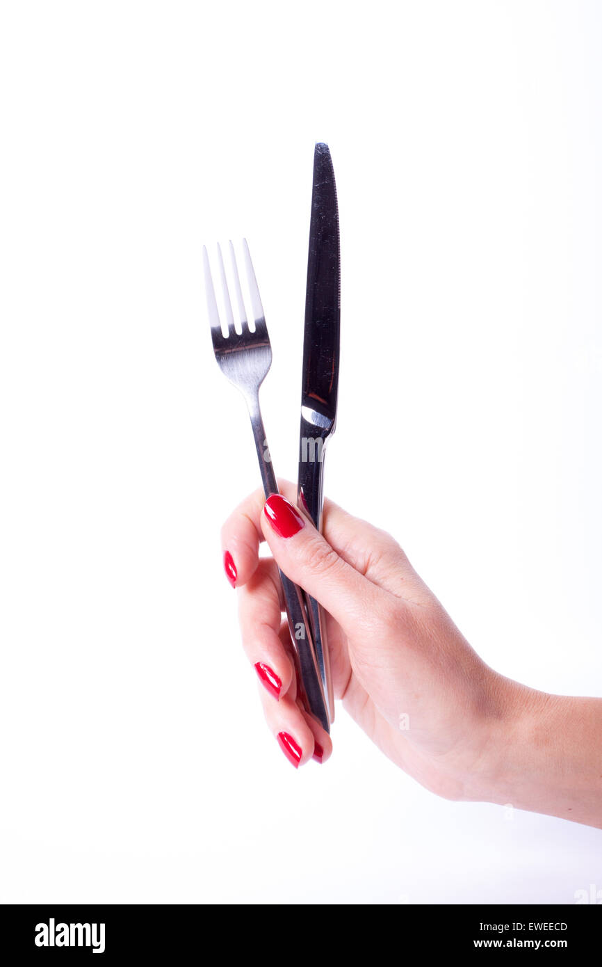 Human hand holding knife fork hi-res stock photography and images - Alamy