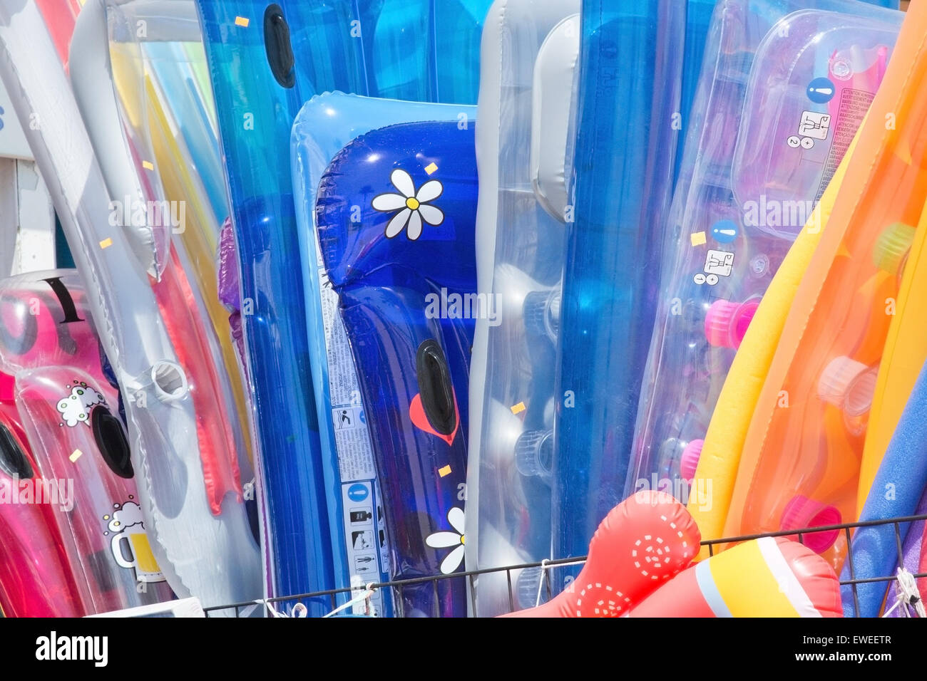 Inflatable beach toys in colorful plastic in a store Stock Photo - Alamy