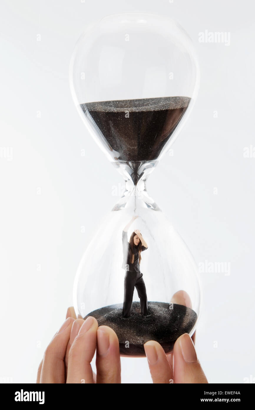 Female hands holding hourglass hi-res stock photography and images - Alamy
