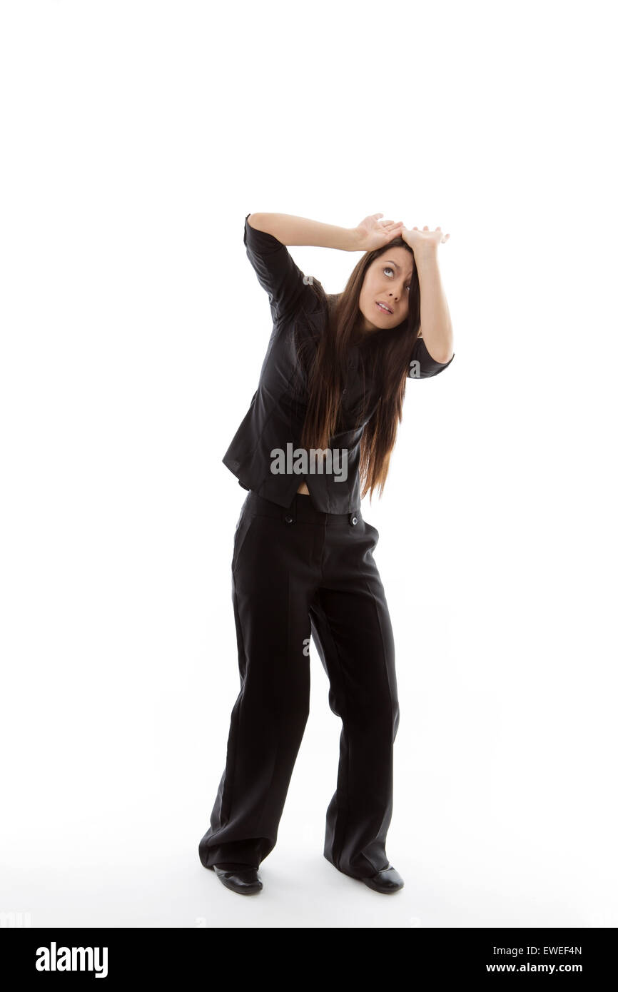 smart looking woman protecting her self with her arms up from somthing ...