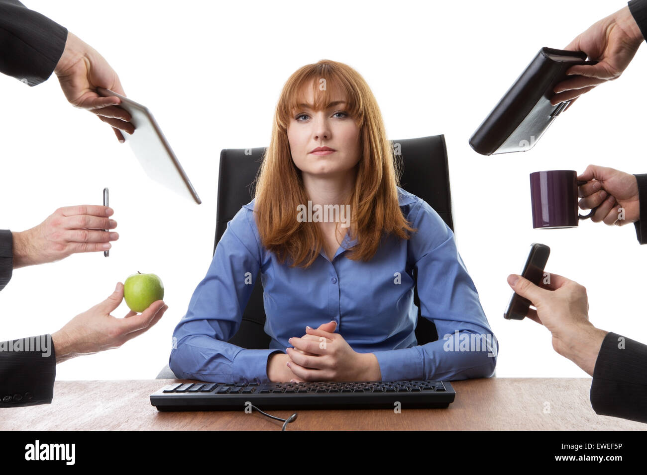 overwhelmed business woman sitting at her desk surrounded by many male ...