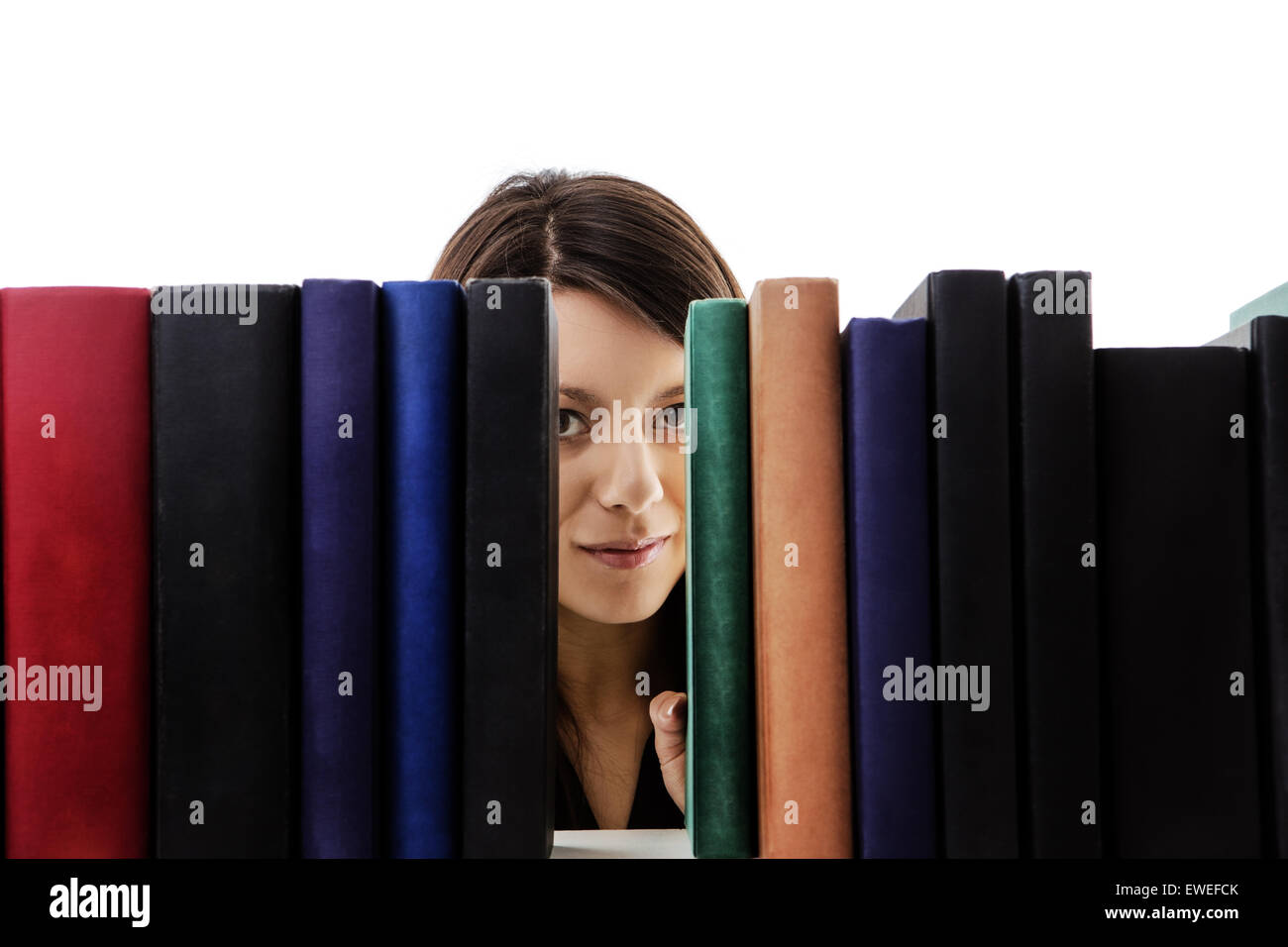 Woman looking through bookshelf hi-res stock photography and images - Alamy
