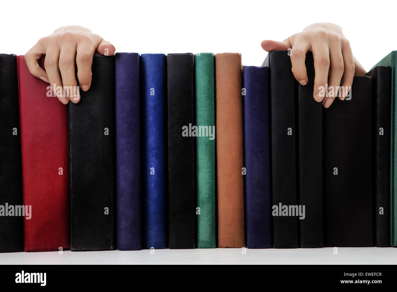 creepy hands coming over books on a bookshelf Stock Photo - Alamy