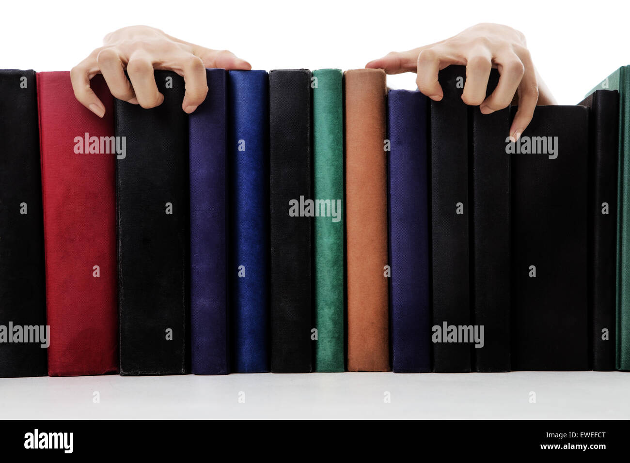 creepy hands coming over books on a bookshelf Stock Photo - Alamy