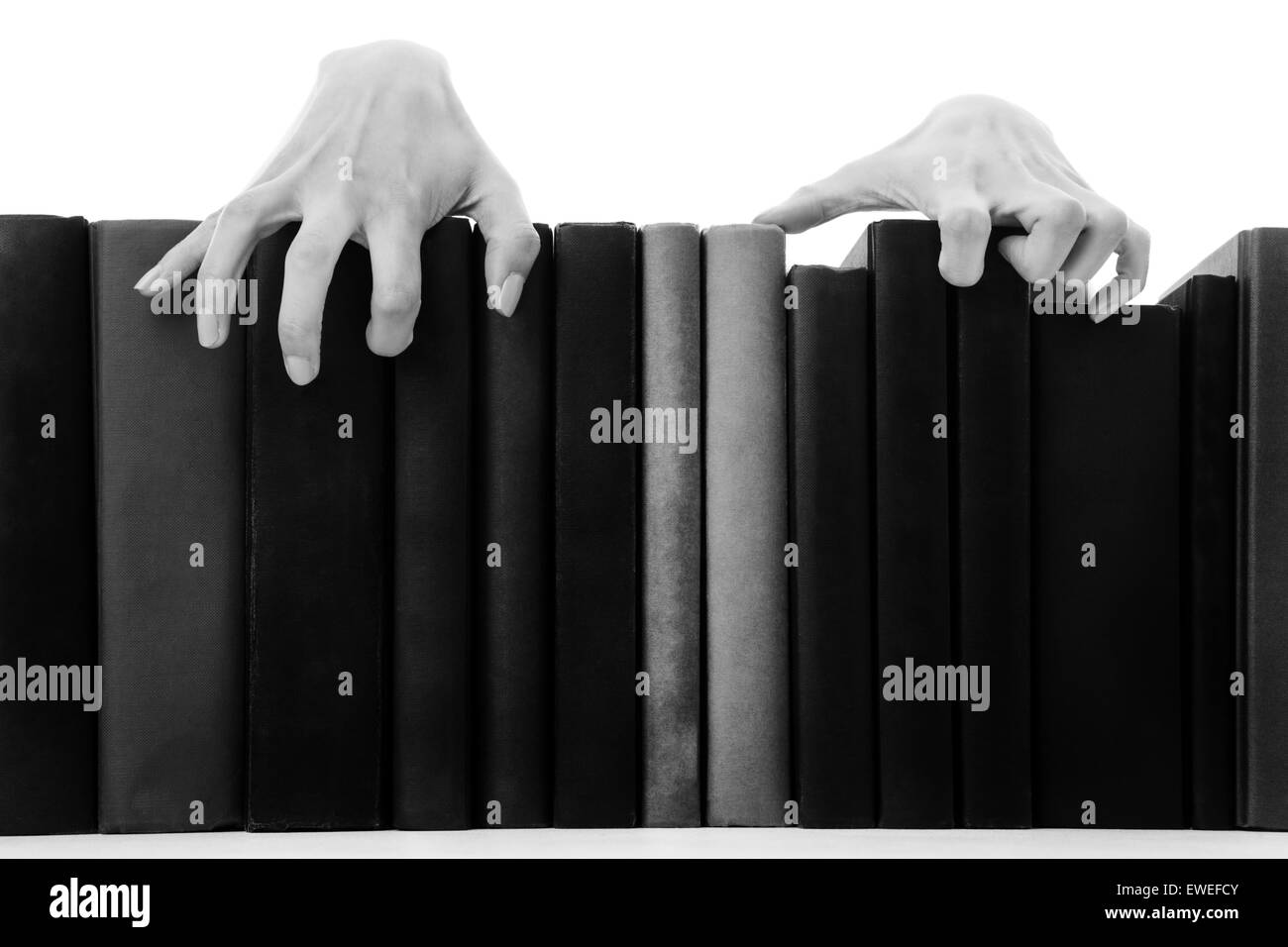 Pile of books woman Black and White Stock Photos & Images - Alamy