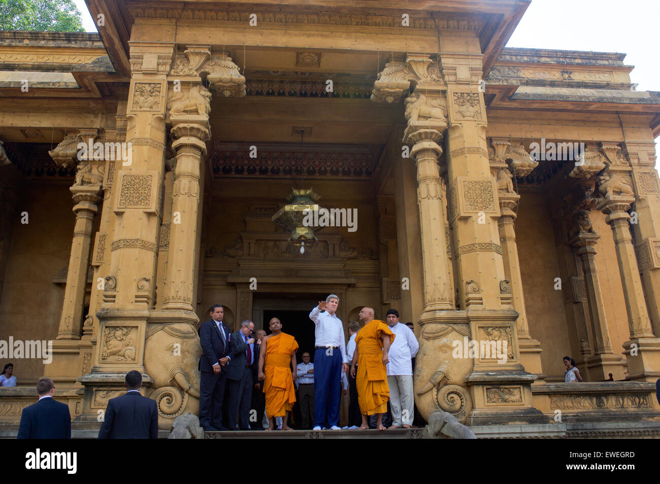 U.S. Secretary of State John Kerry talks with a monk at the Kelaniya ...