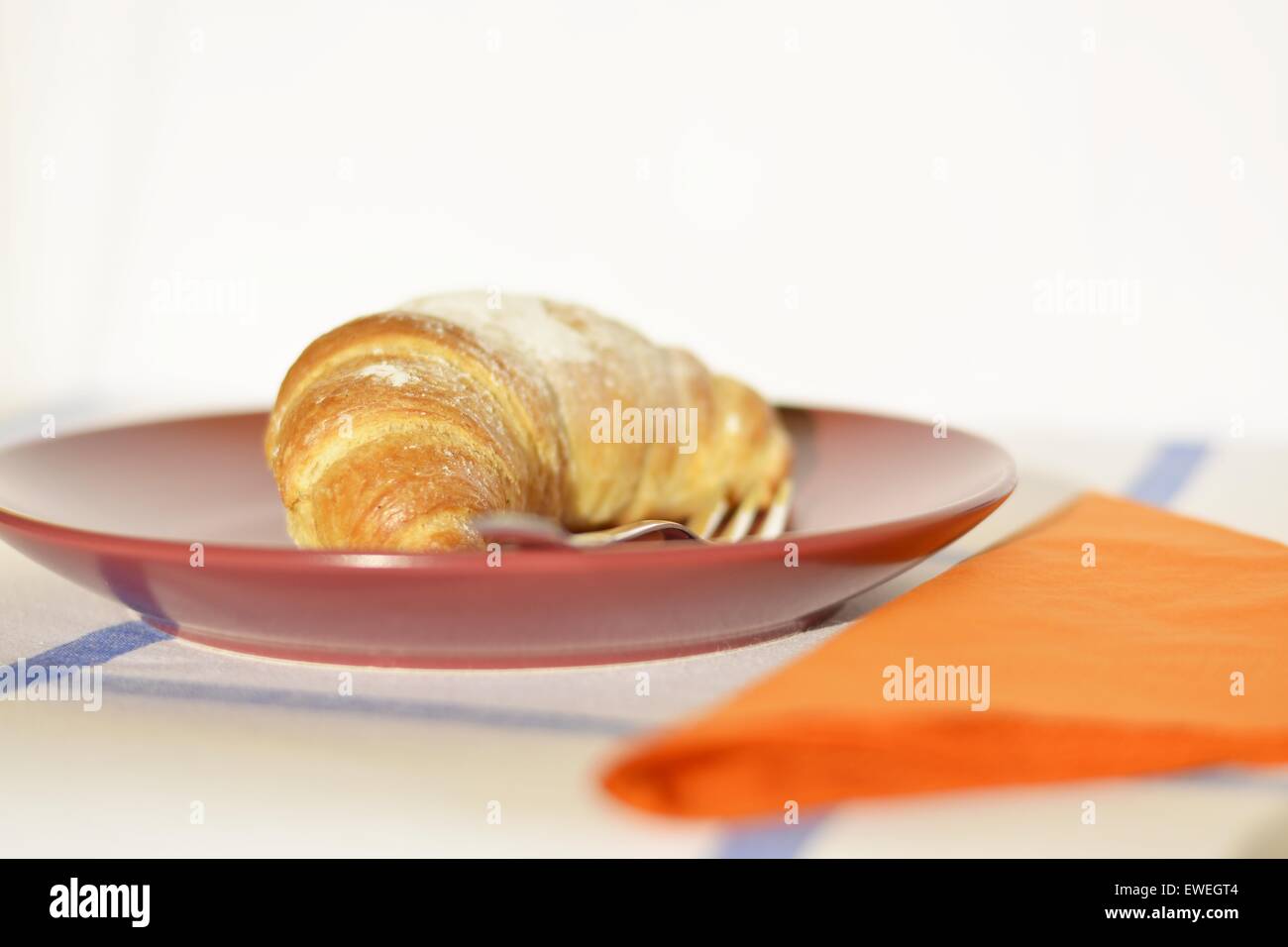 Croissant on a plate Stock Photo - Alamy
