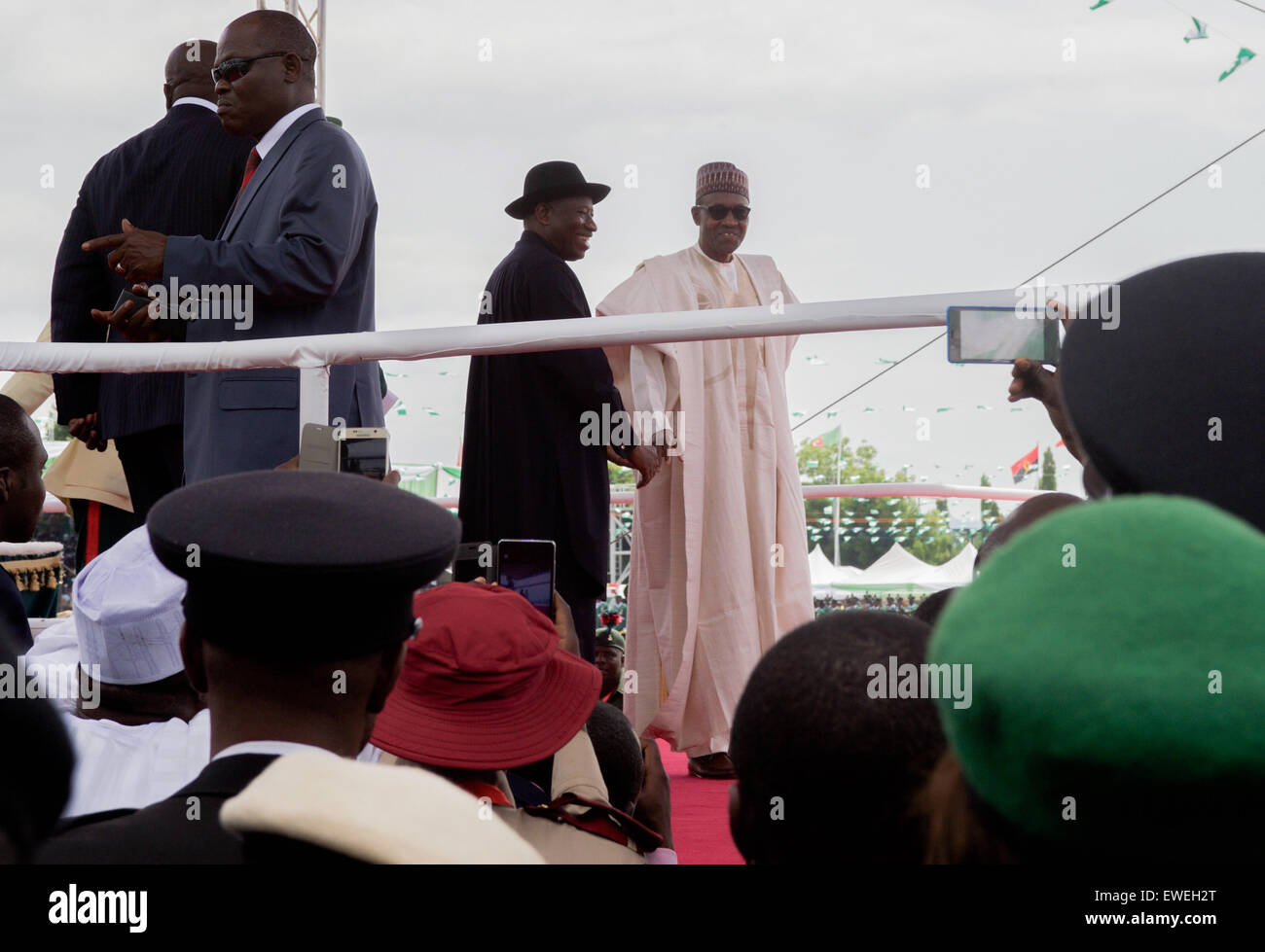 Former Nigerian President Goodluck Jonathan, in hat, stands with newly ...