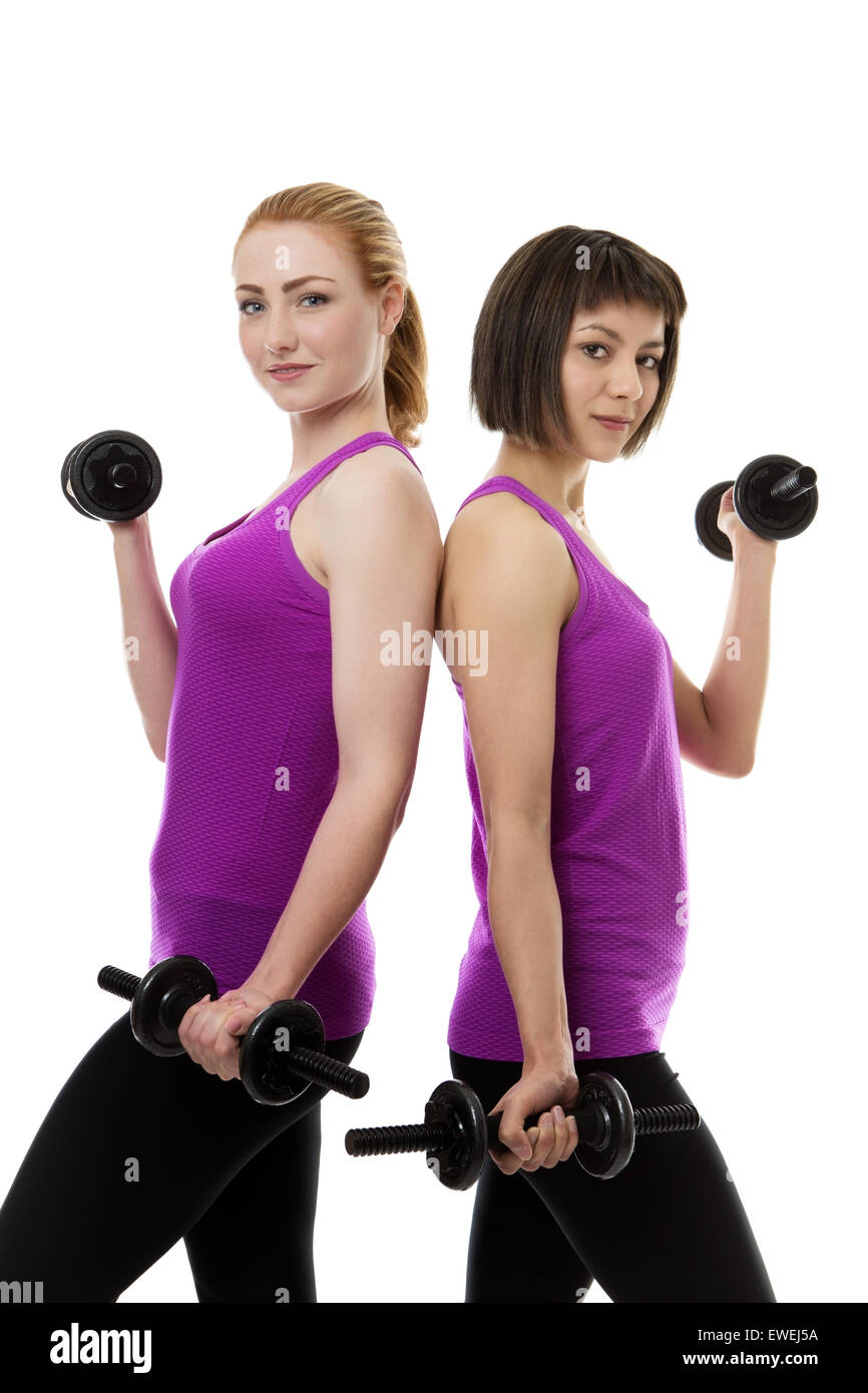 two standing fitness models back to back weight training together Stock ...