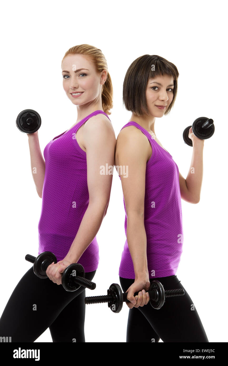 two standing fitness models back to back weight training together Stock ...