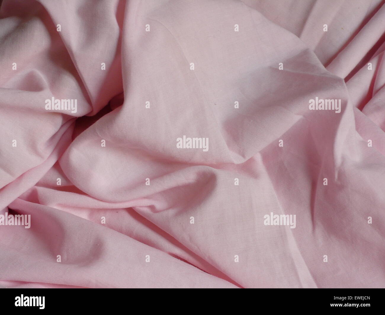 pink cotton sheet, in interior Stock Photo - Alamy