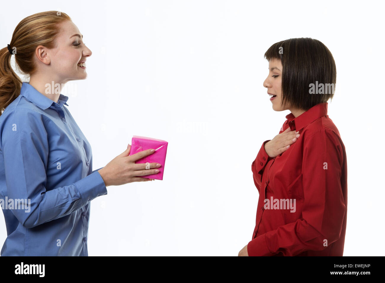 woman given a gift to her work friend Stock Photo - Alamy