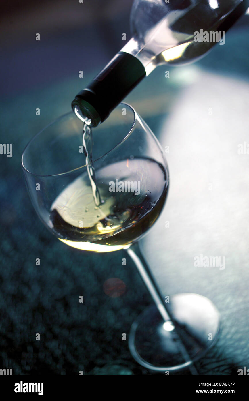 White wine being poured in a restaurant Stock Photo - Alamy