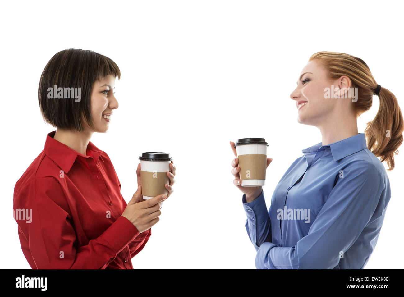 two business woman chatting and gossiping over a coffee Stock Photo - Alamy