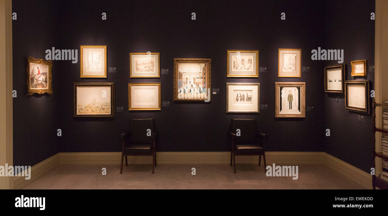 A wall of paintings by Laurence Stephen Lowry at the stand of Richard ...