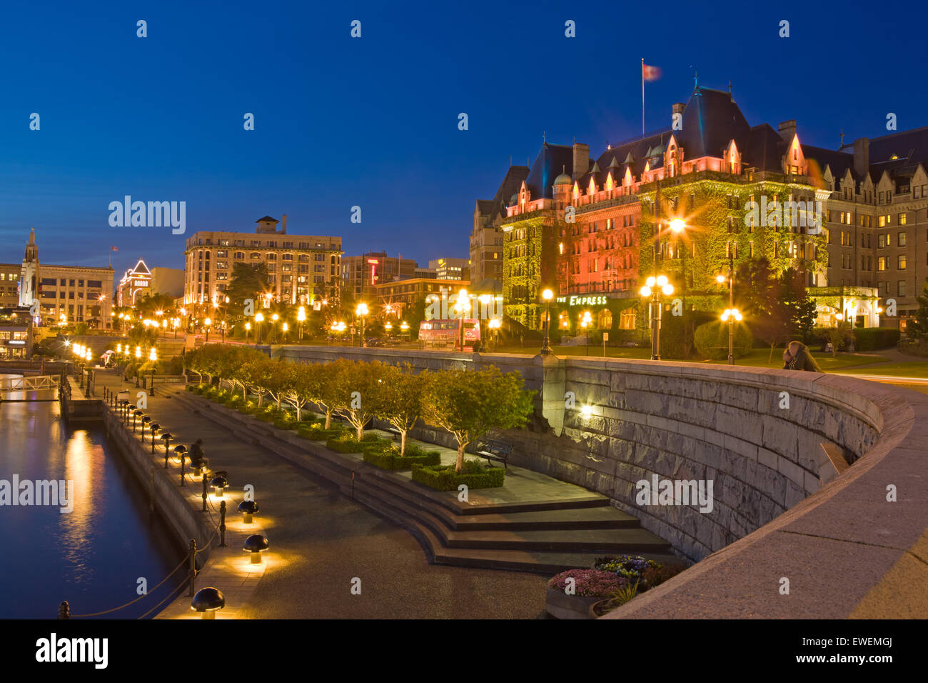 Illuminated Victoria's Inner Harbour with the landmark Empress Hotel ...