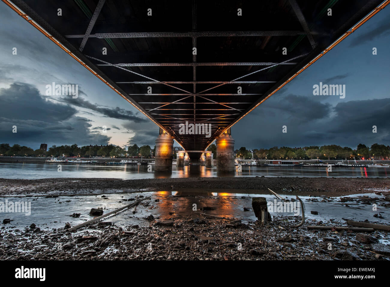 Under the bridge - underneath Albert Bridge on the river Thames at low ...