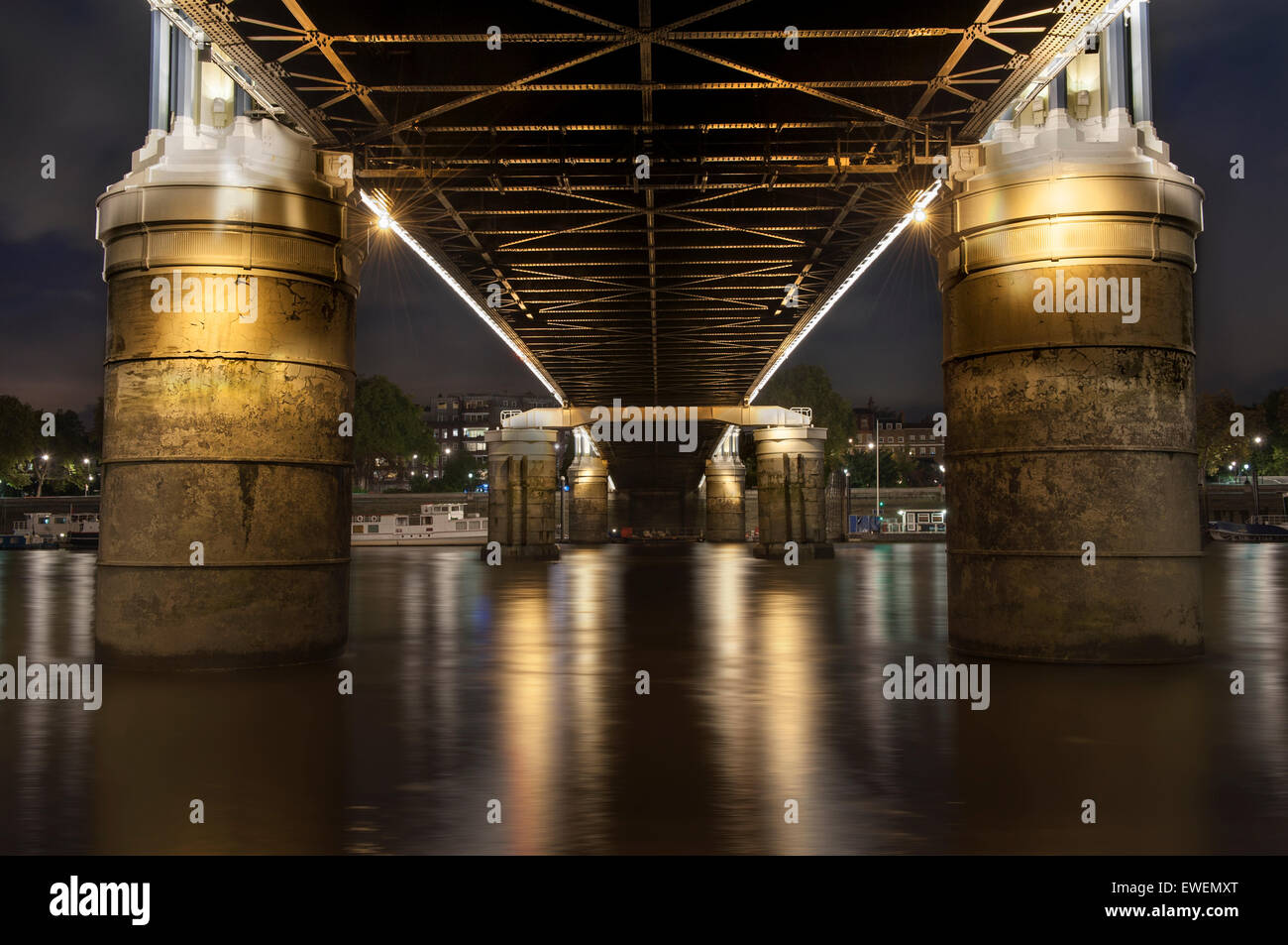 Under the bridge - underneath Chelsea Bridge on the river Thames at low ...