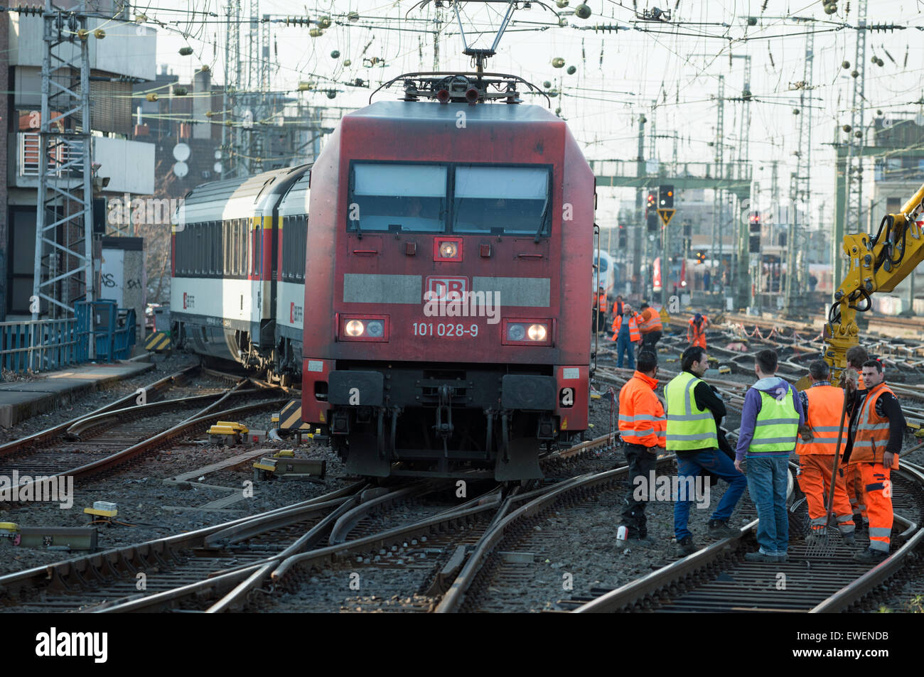 J.Hubert railway track maintenance staff working on a busy mainline ...