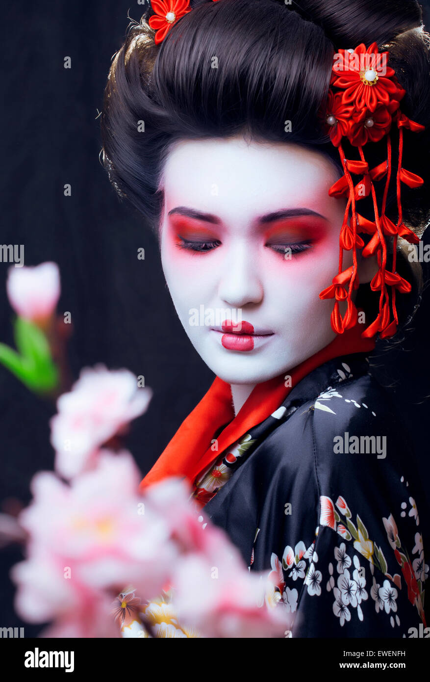 young pretty geisha in kimono with sakura and decoration Stock Photo ...
