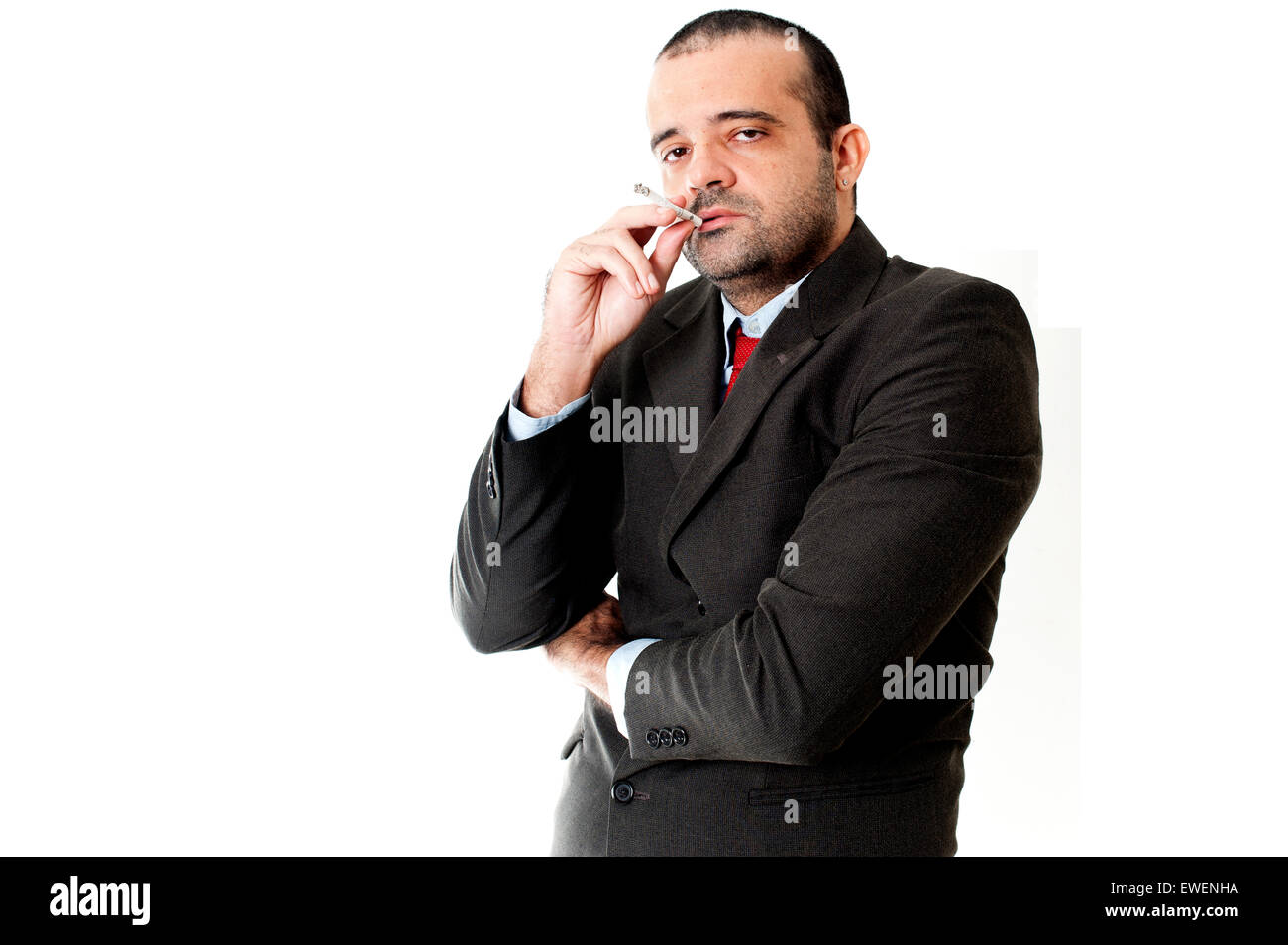 Face of a Serious Business man smoking Stock Photo - Alamy