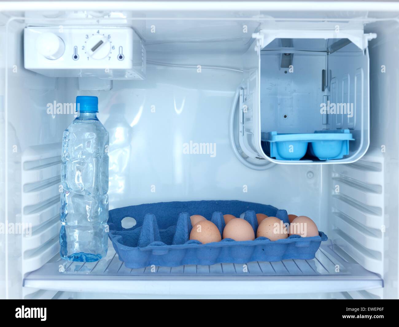 A shot of an open bar fridge Stock Photo - Alamy