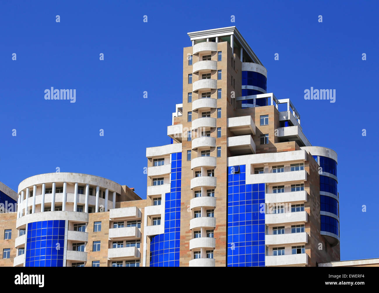 Facade of a massive building with galleries and balconies Stock Photo ...