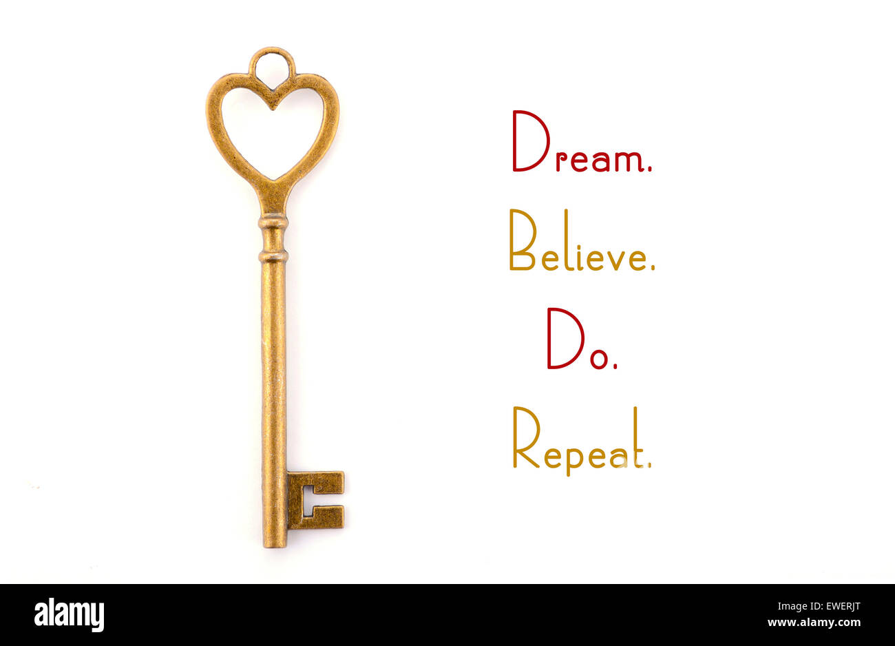 Gold heart shape key with inspirational phrase, dream believe do repeat ...