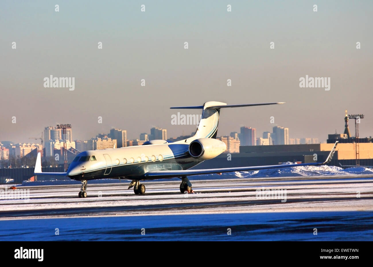 Twin-engined small jet on a parking place at the airport Stock Photo ...