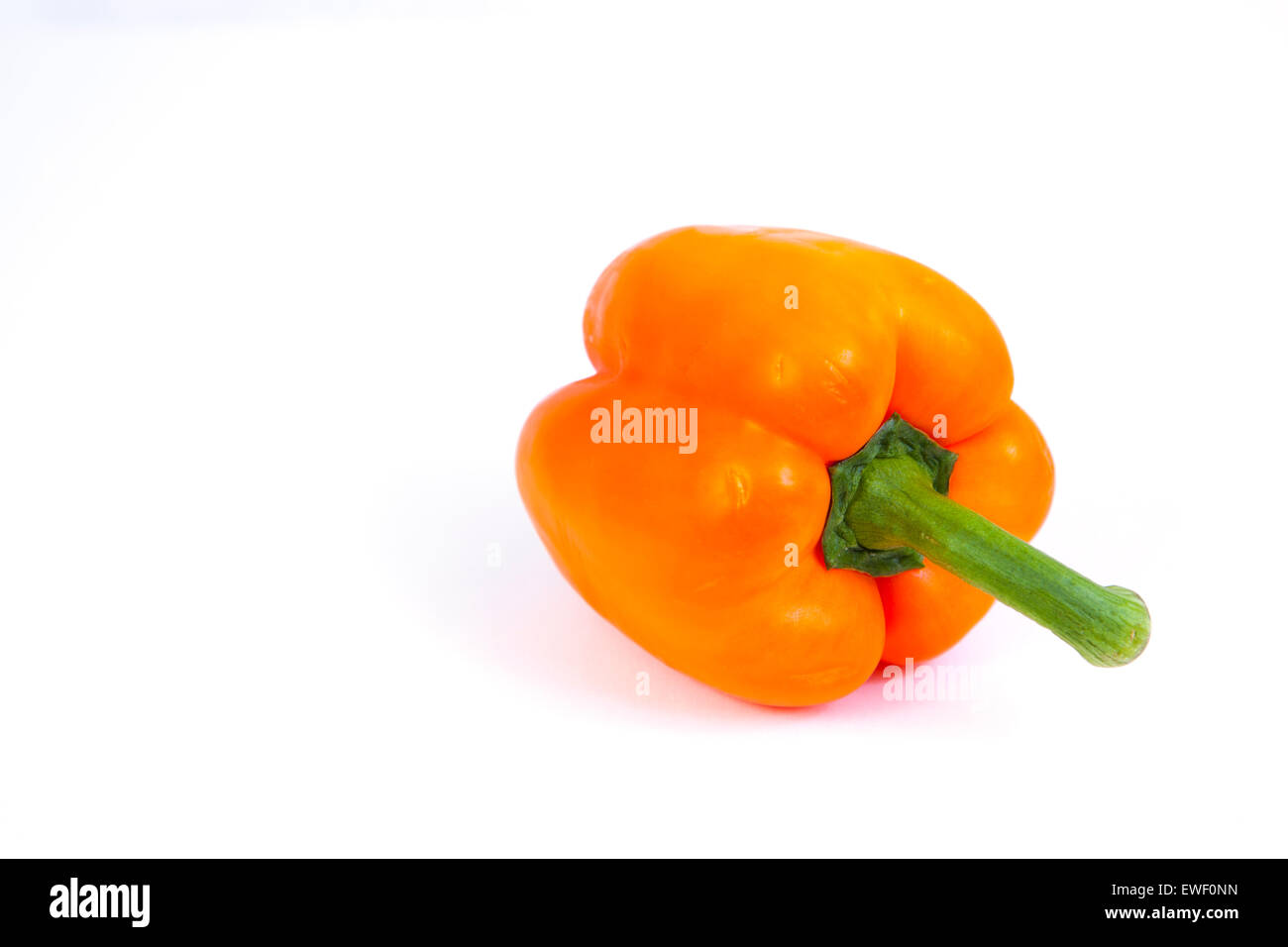 Orange Pepper Against White Background with Space for Editorial Stock ...